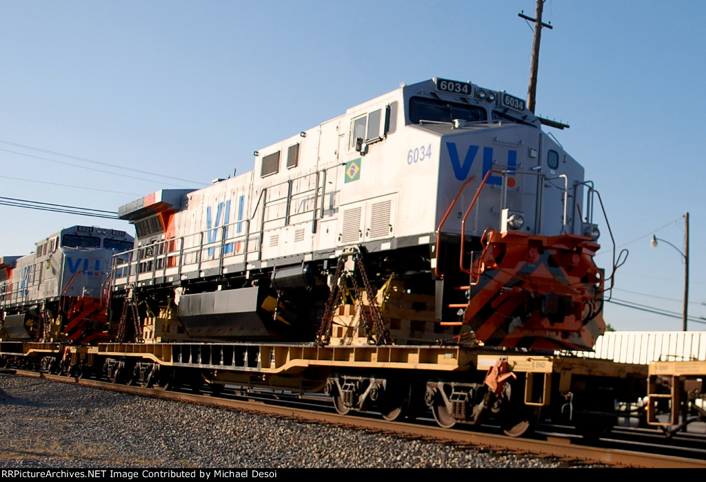 VLI BB40-9WM #6034 is one of 8 locomotives in this train heading east bound for the port of ...